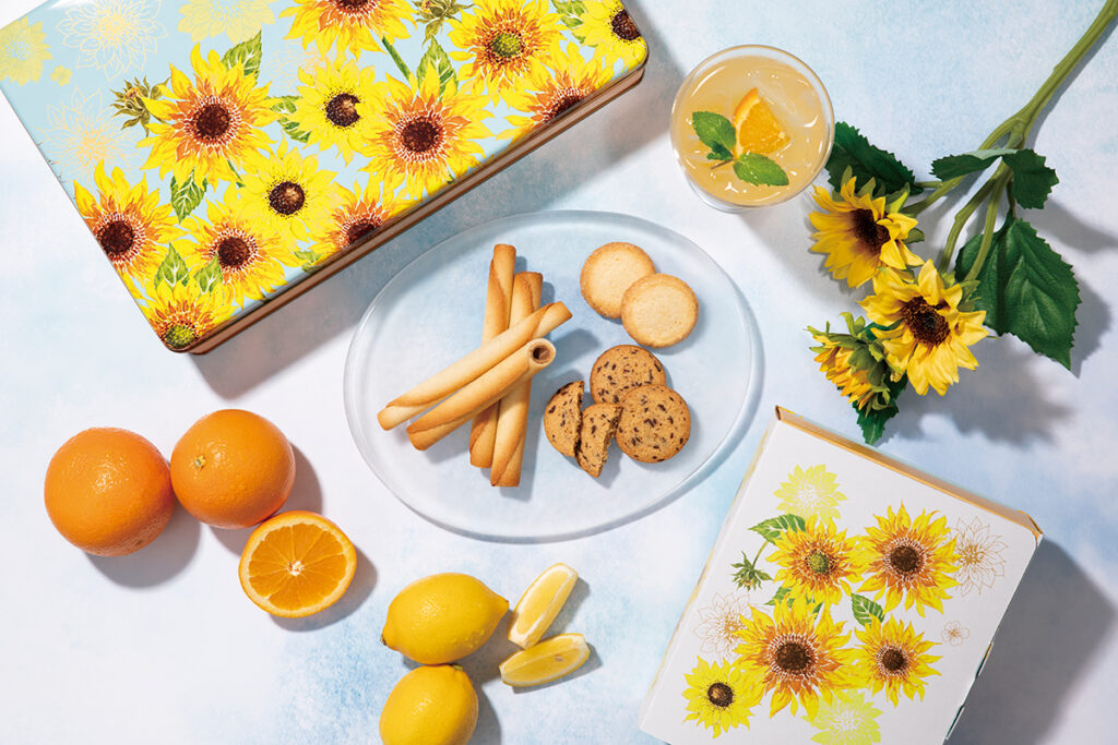 ヨックモックと日比谷花壇がコラボで贈る四季シリーズのギフト 「夏の贈り物」に想いを込めて 青空にひまわりを描いた『カドー ドゥ レテ』 ～6月15日（土）より新登場～ | 株式会社ヨックモック ...
